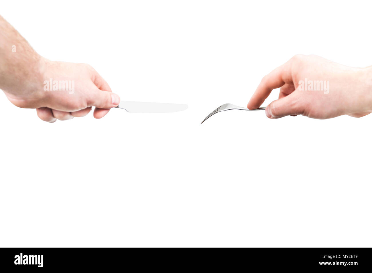 Male hands of the left-hand man hold a metal fork and knife, isolated ...