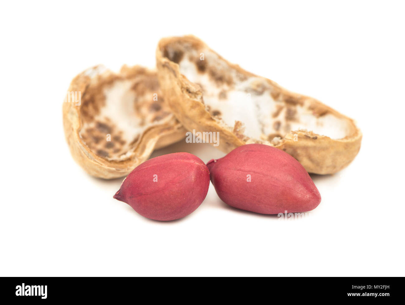 Broken peanuts in shell on white background Stock Photo - Alamy