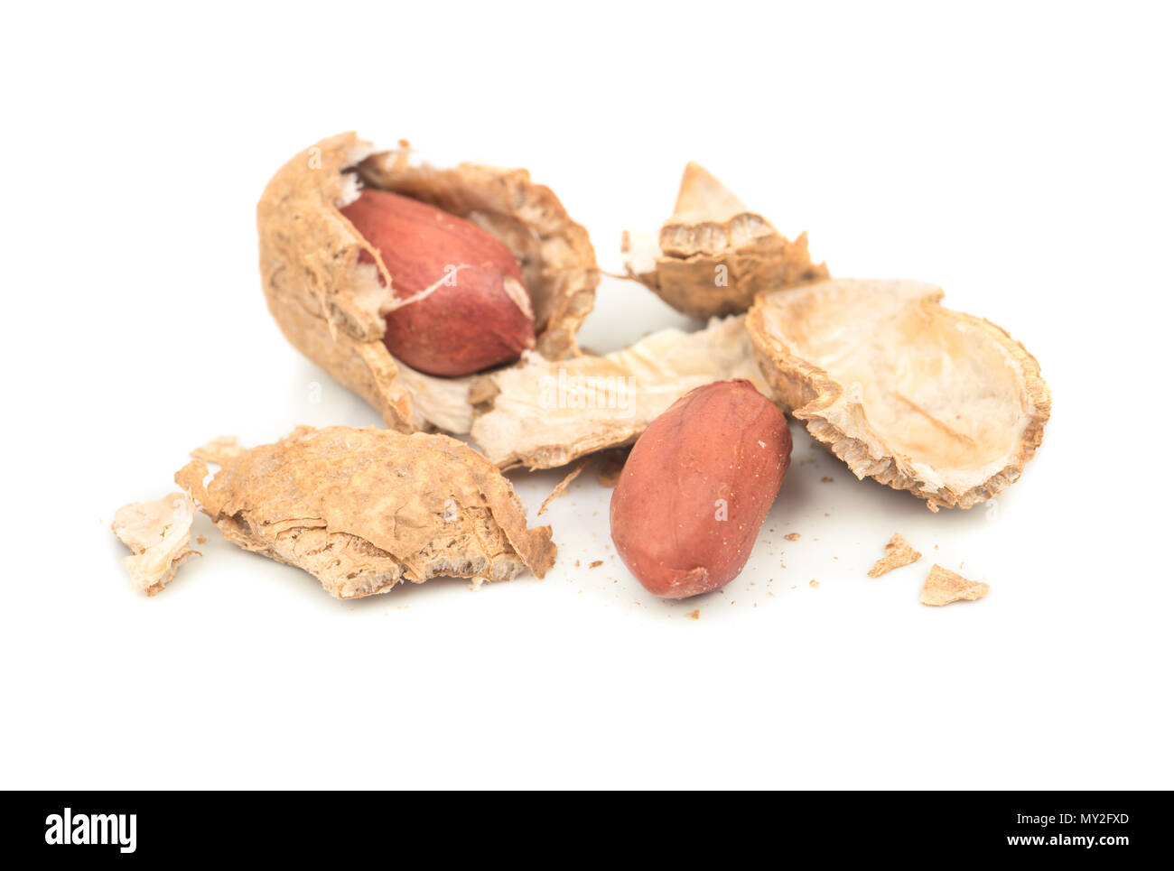 Broken peanuts in shell on white background Stock Photo - Alamy