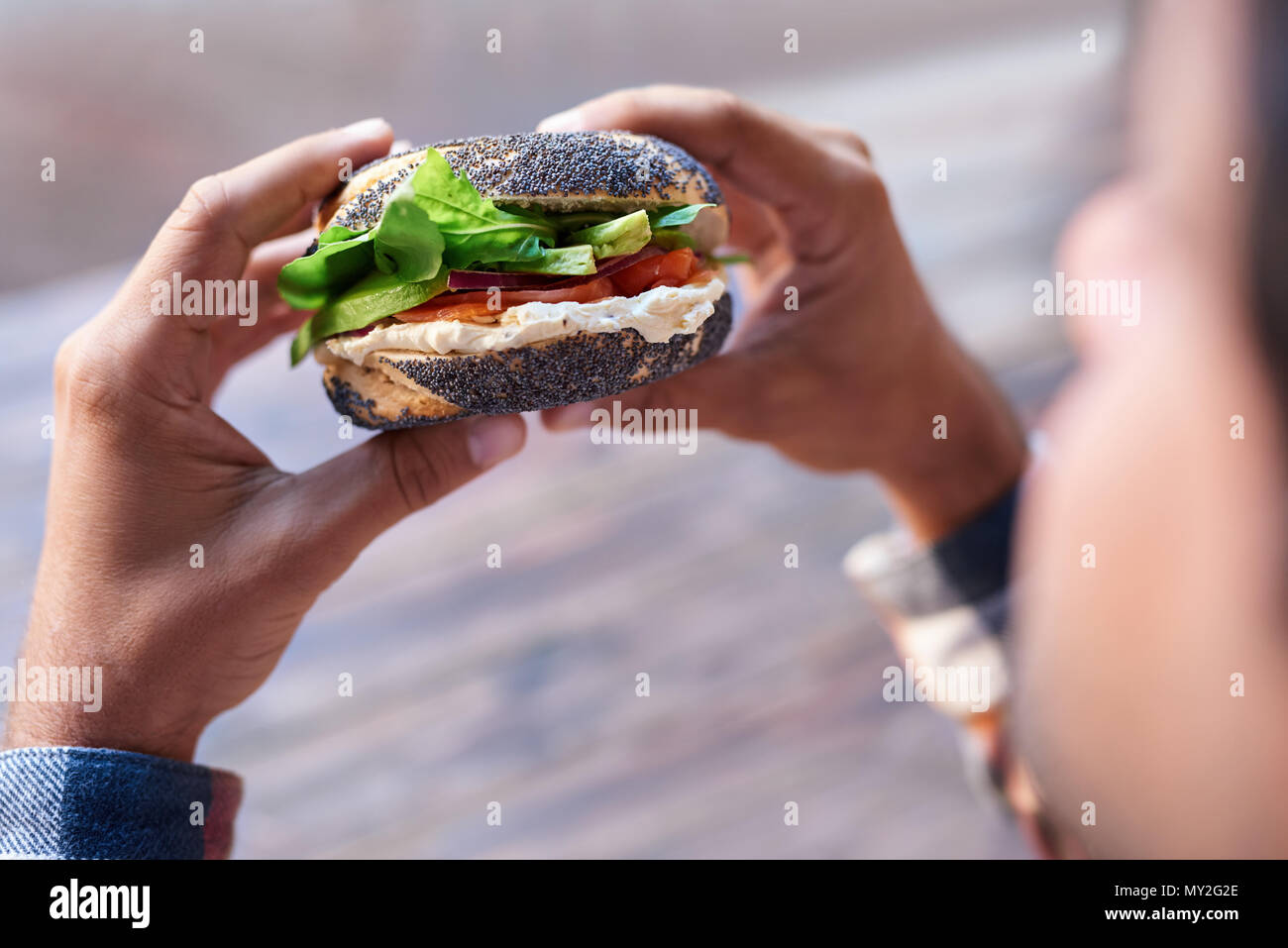 Man eating sandwich standing hi-res stock photography and images - Alamy