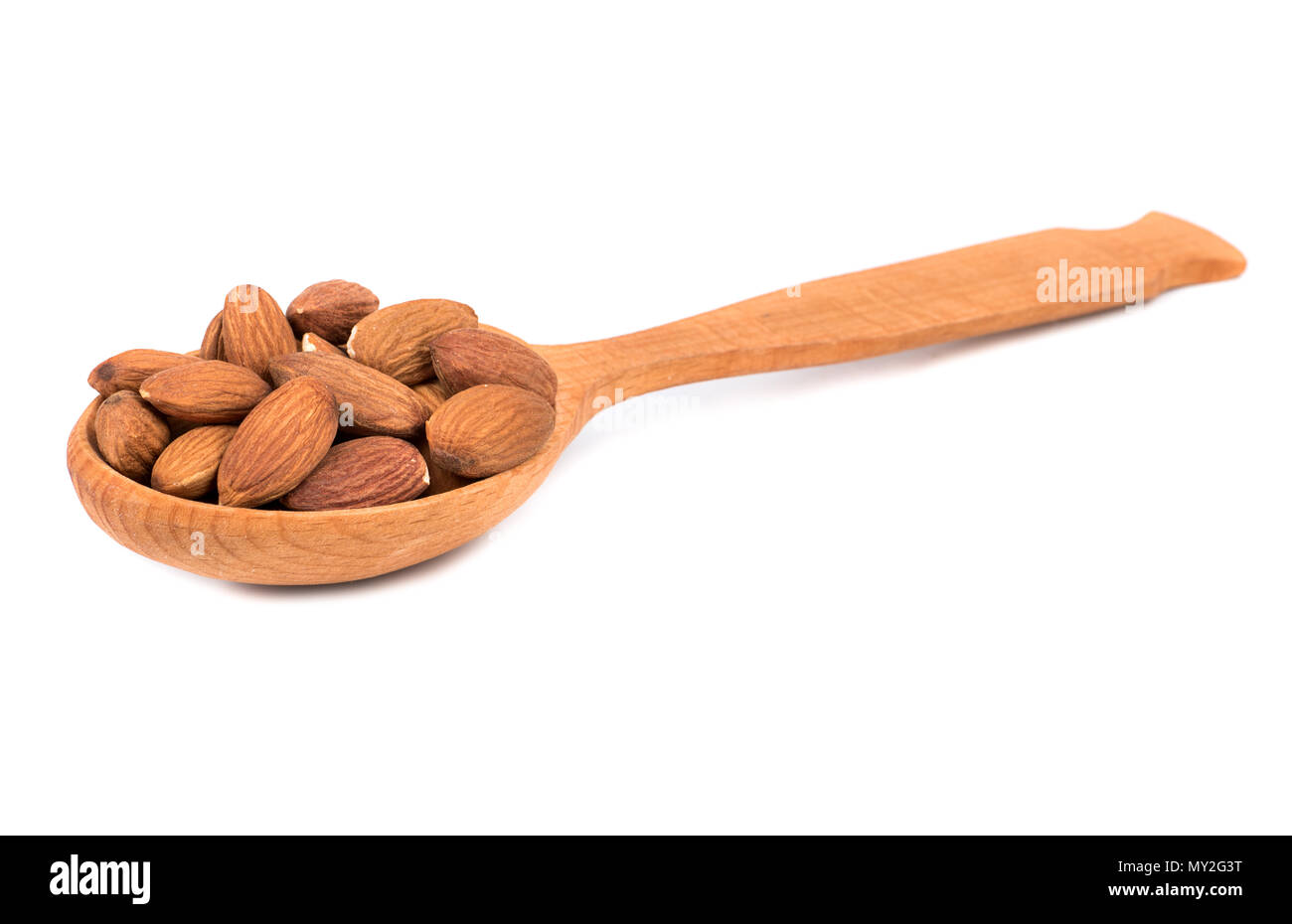 Wooden spoon full of almond nuts isolated on a white background Stock ...