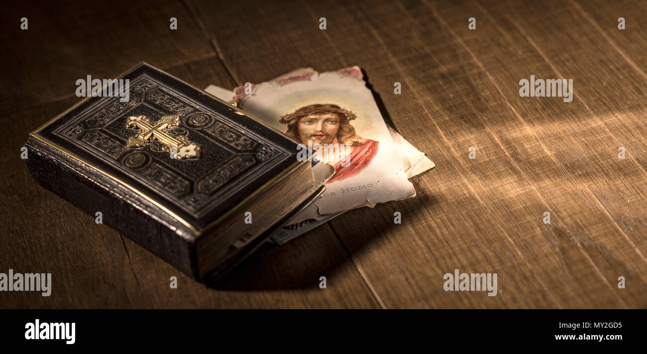 Sacred bible and Holy card with Jesus Christ image on a wooden desk ...