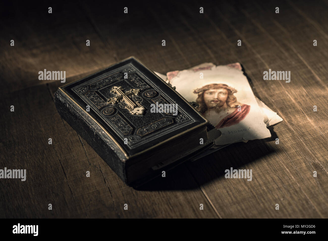 Sacred bible and Holy card with Jesus Christ image on a wooden desk ...