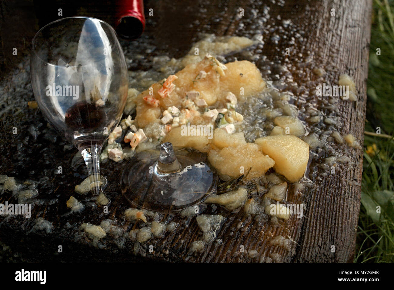 Broken wine glass next to disquisting vomit, outdoor closeup Stock ...