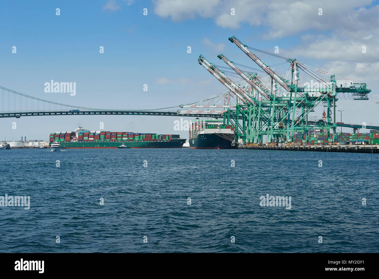 The Container Ship, SEAMAX NEW HAVEN, Being Guided By Tugs Under The ...