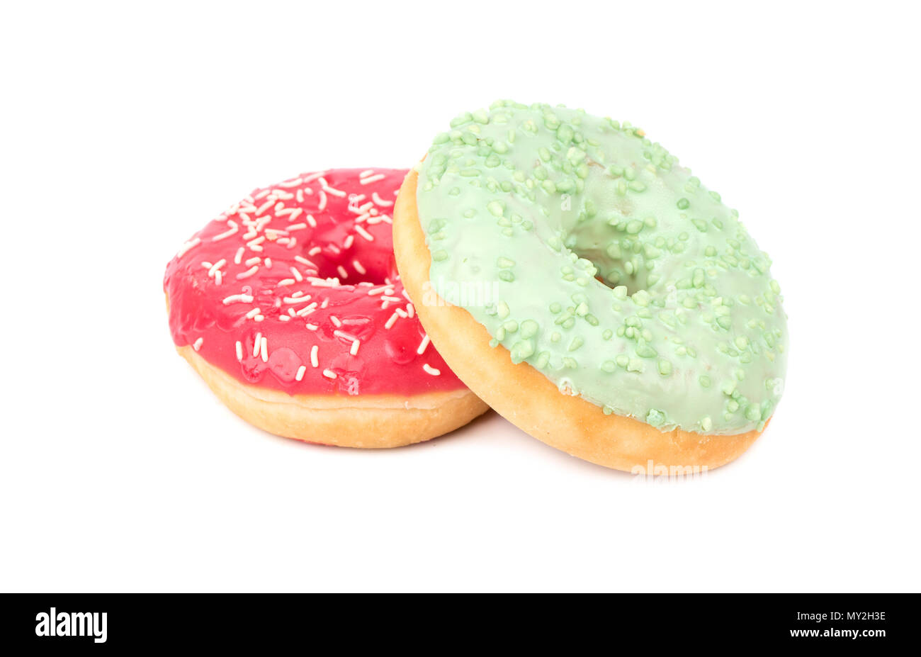 Two donut with green and pink icing isolated on white background Stock ...