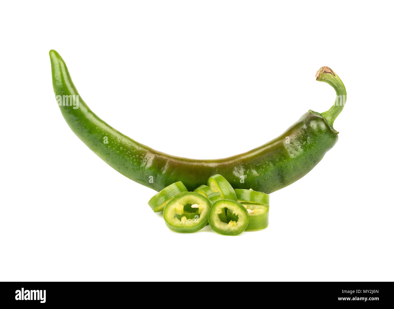 Twisted fresh green chilli with slices on a white background Stock ...