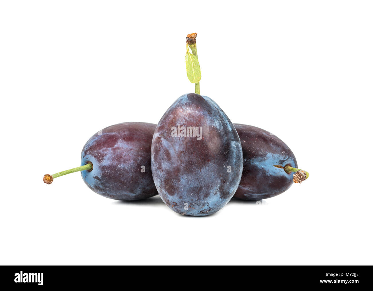 Three fresh plums on white background closeup Stock Photo - Alamy