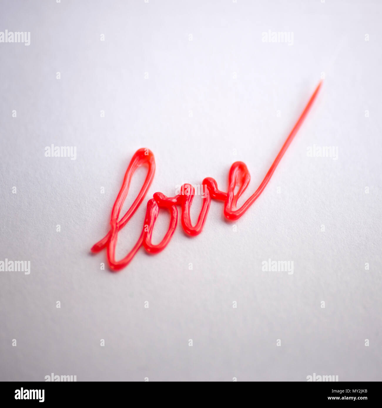 red the writing love drawn by 3d pen Stock Photo - Alamy