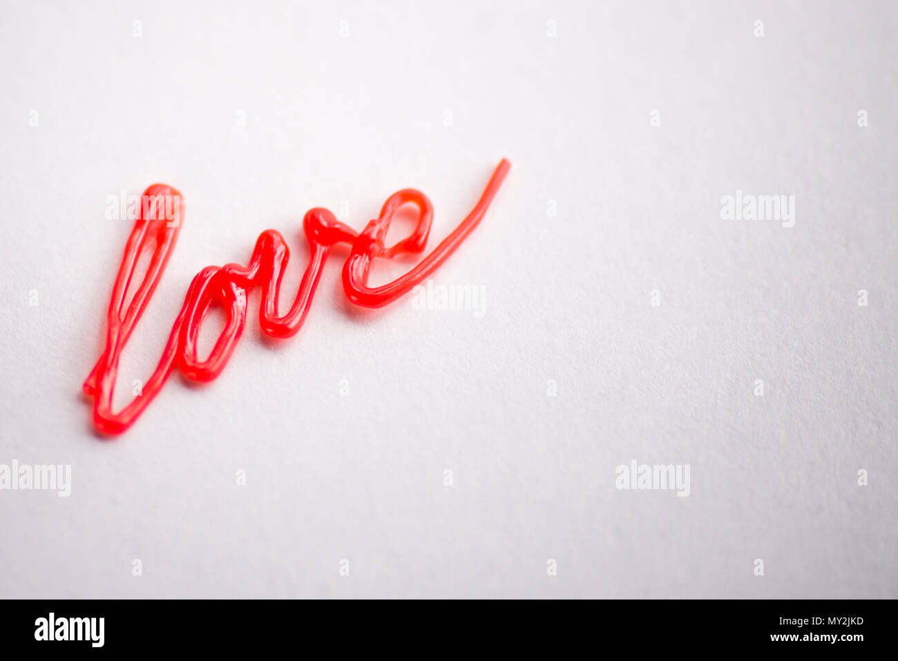 red the writing love drawn by 3d pen Stock Photo - Alamy