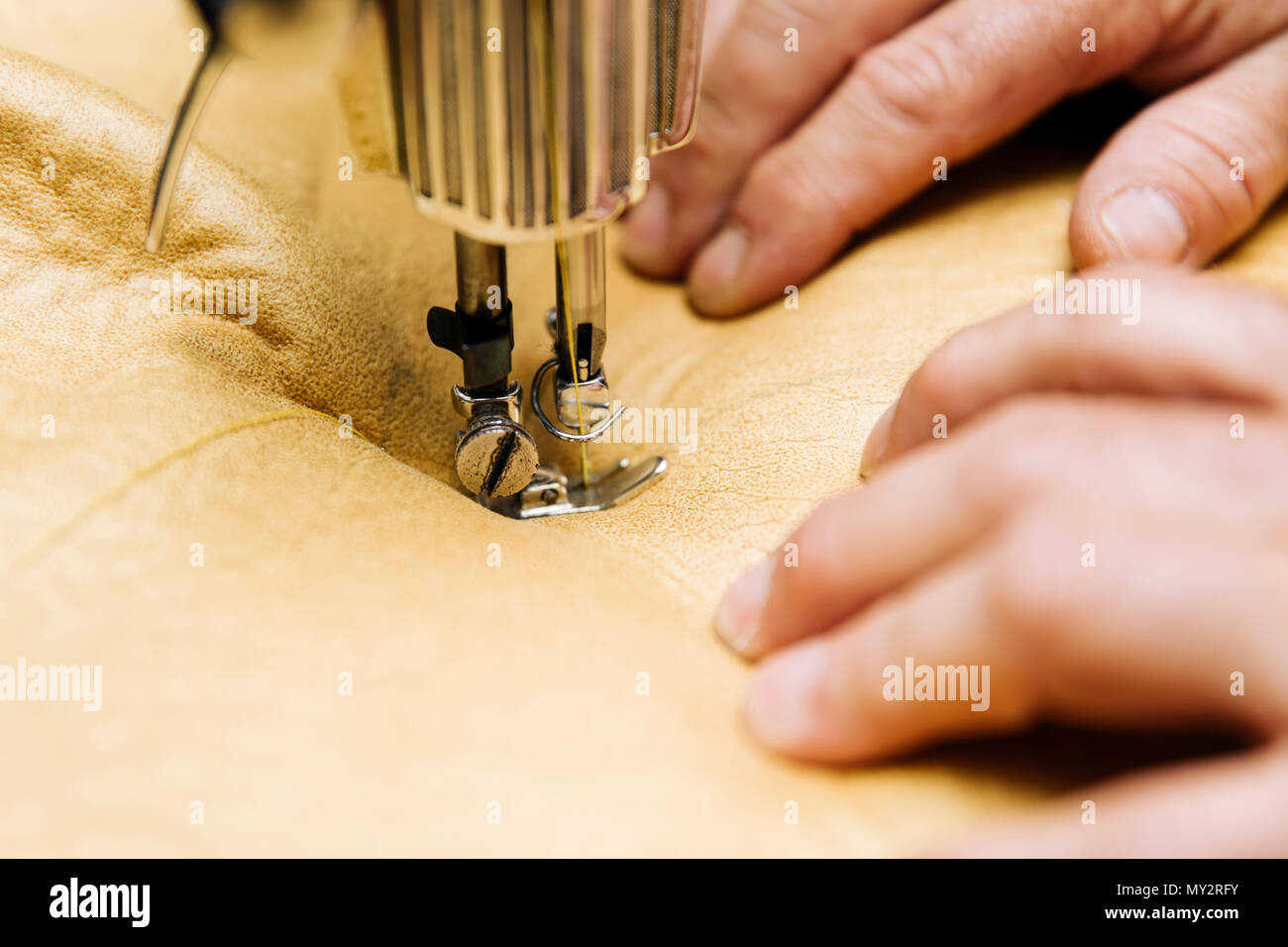 Closeup view at the upholstery sewing machine Stock Photo - Alamy
