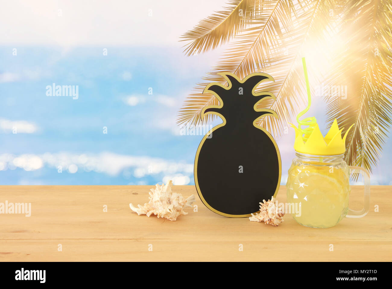 fresh lemonade drink in cute pineapple shape glass with twisted straw ...