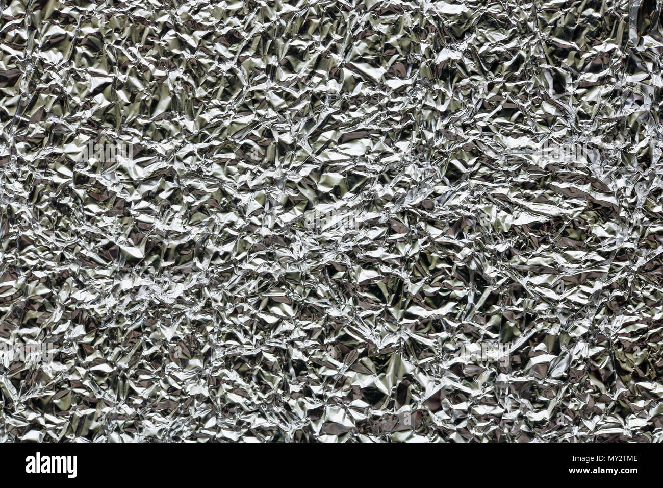 Texture of crumpled aluminum foil sheet. Studio macro shot background ...