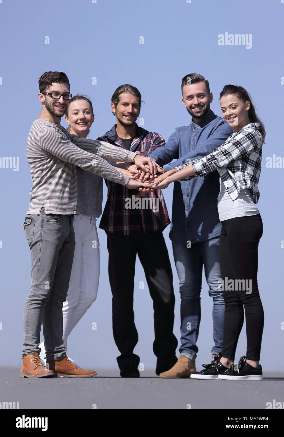 group of young people clasped their hands together Stock Photo - Alamy