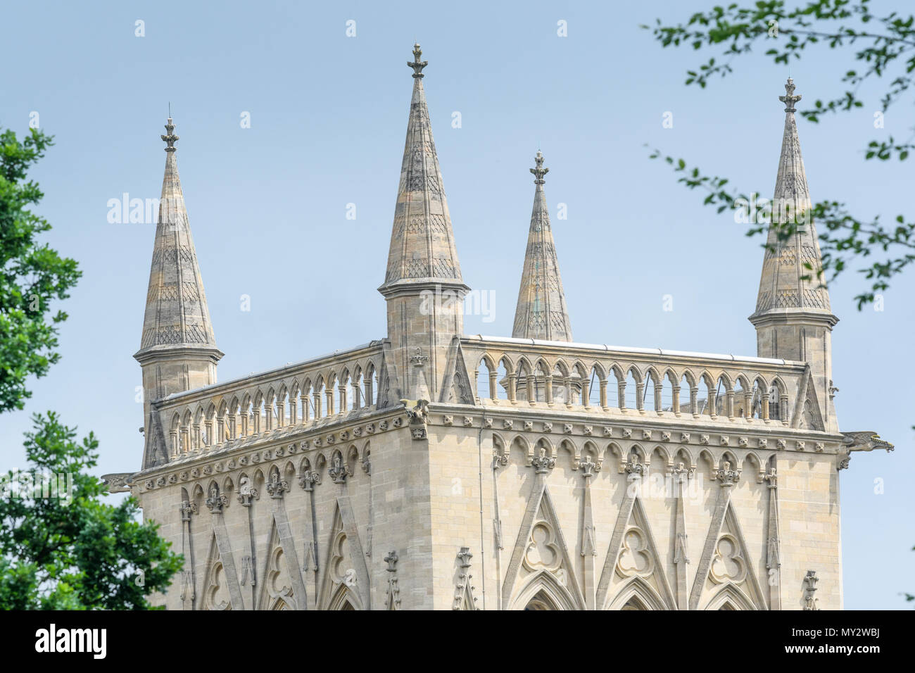 Four spires on the top of the square stone tower at the entrance to St ...