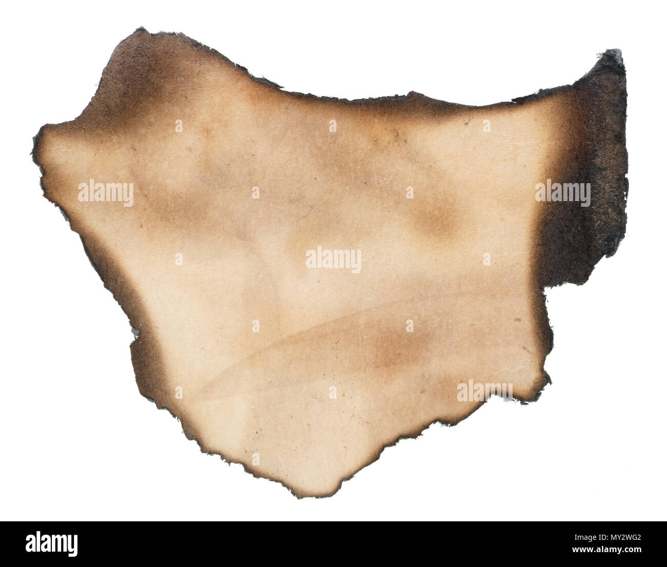 A small piece of yellowed paper with burned black edges. Isolated on ...