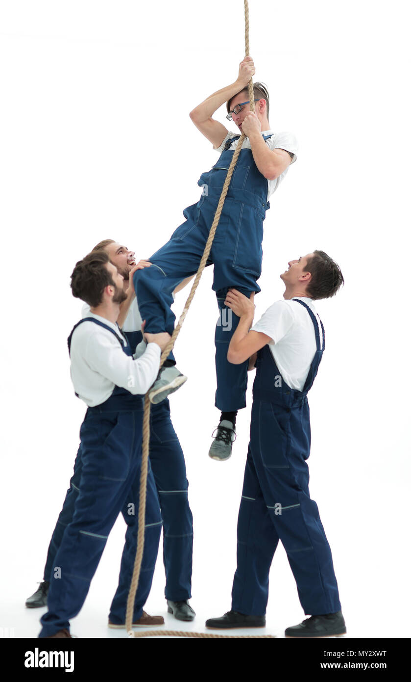 view from the top. team work in helping the leader to climb up Stock ...