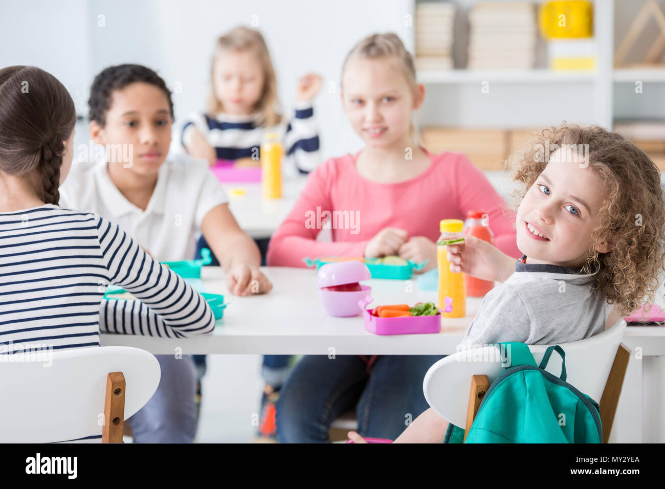 Friends eating together at canteen hi-res stock photography and images ...