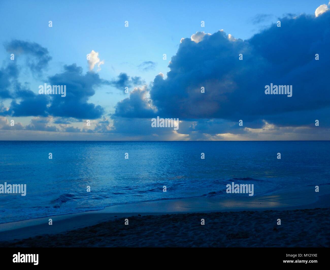 Beautiful sunset after a sunny beach day: calm atlantic ocean and a ...