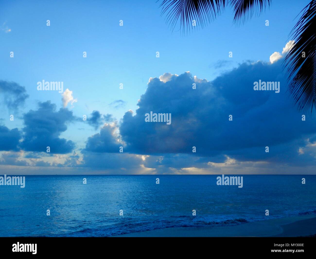 Beautiful sunset after a sunny beach day: calm atlantic ocean and a ...