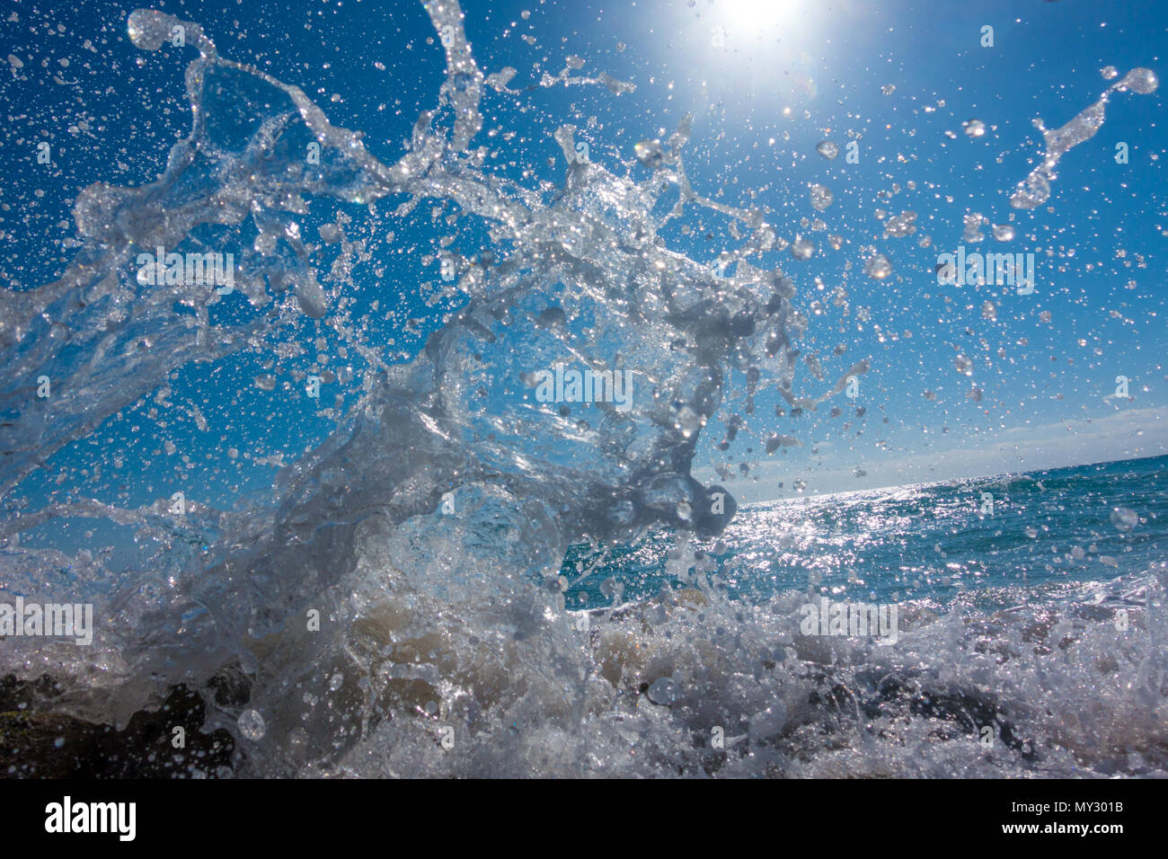 Bursts of the waves of the sea, Wave bursting over rocks Stock Photo ...