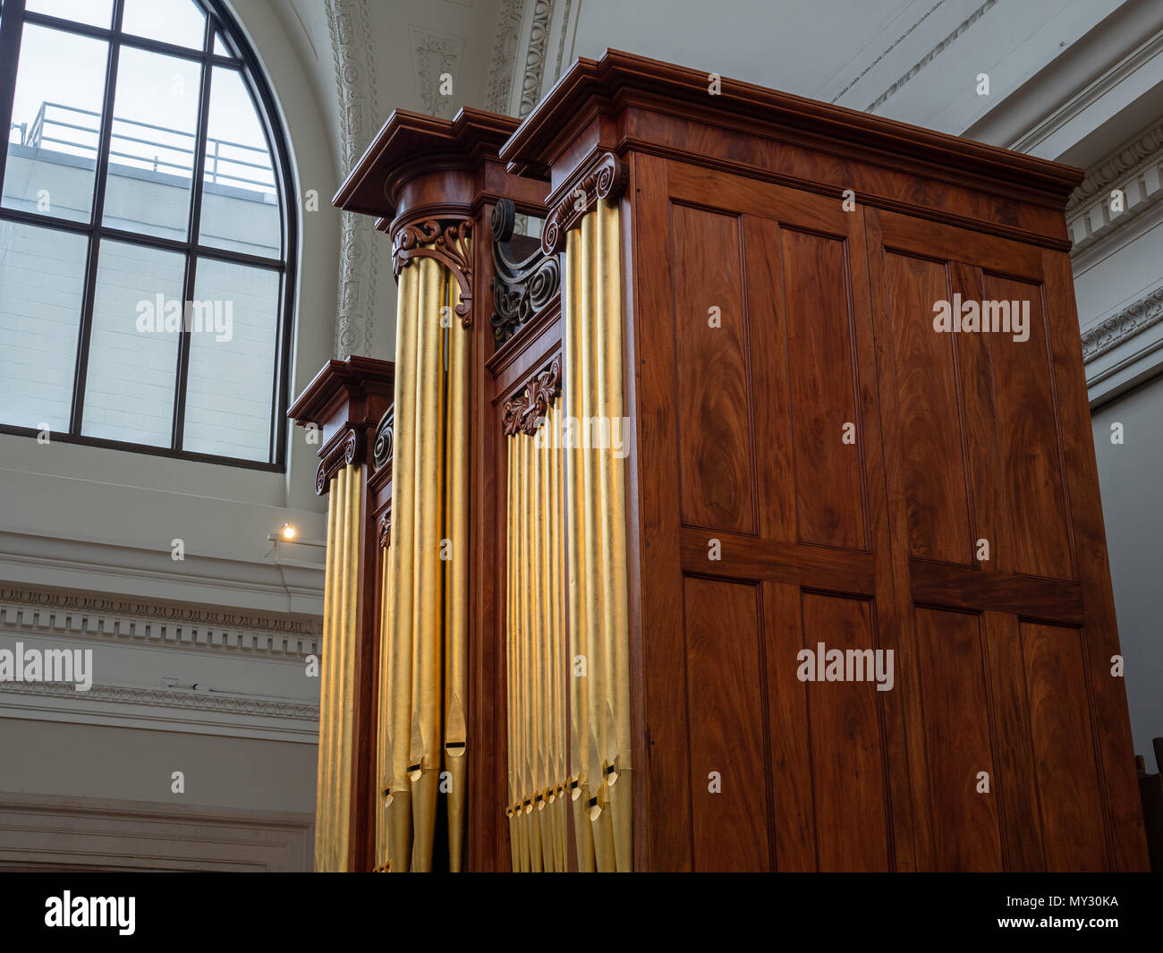 A side view of a massive oak 19th century pipe organ Stock Photo - Alamy