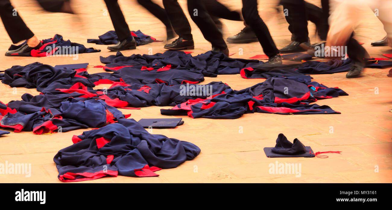 Graduate Students run over grad outfits during university graduation ...