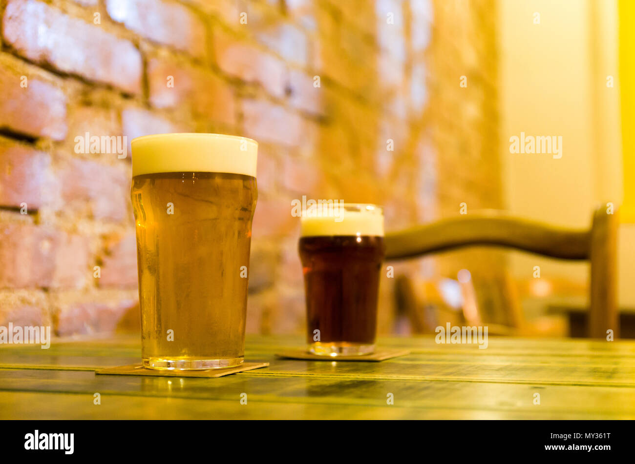 Glass pint of beer on top of bar counter, brewpub, craftbeer Stock ...