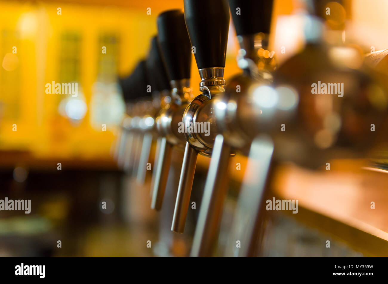 Beer taps on bar counter, brewpub. Craft beer Stock Photo - Alamy