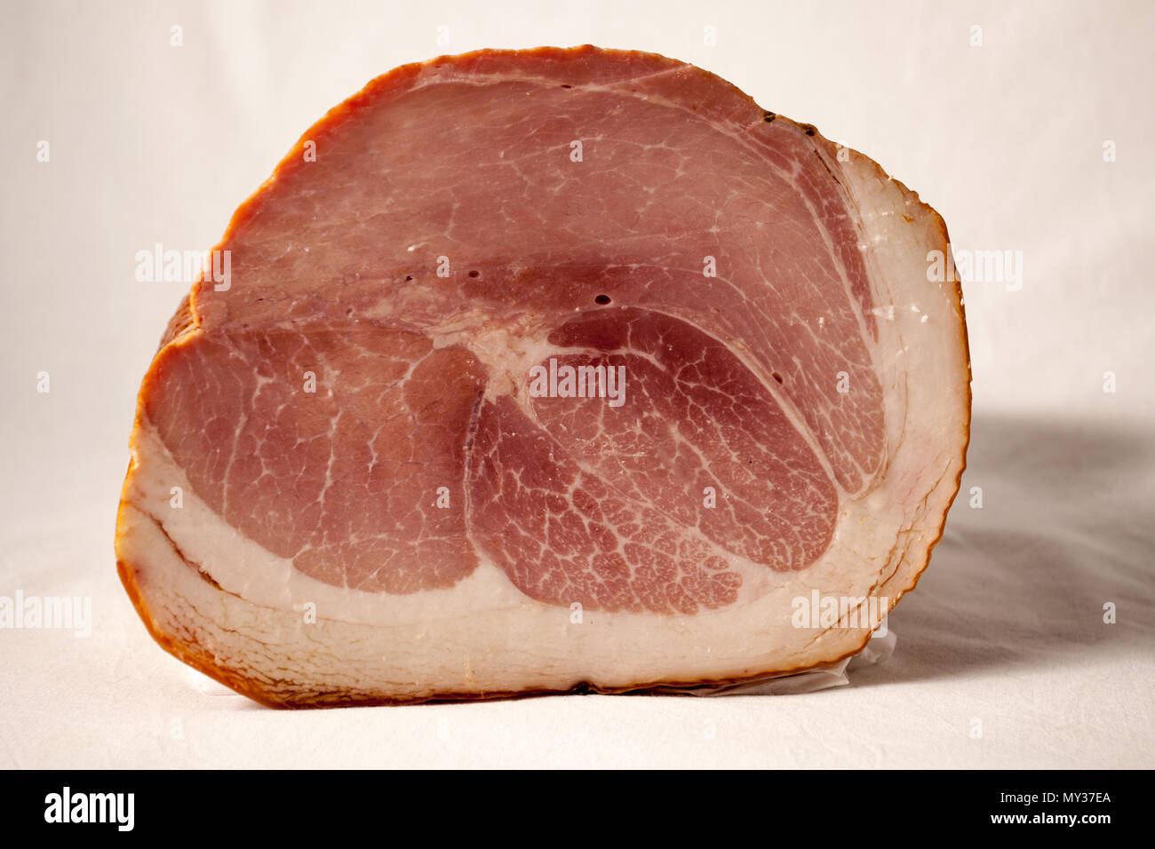 Typical italian cooked ham on a white background in the studio Stock ...
