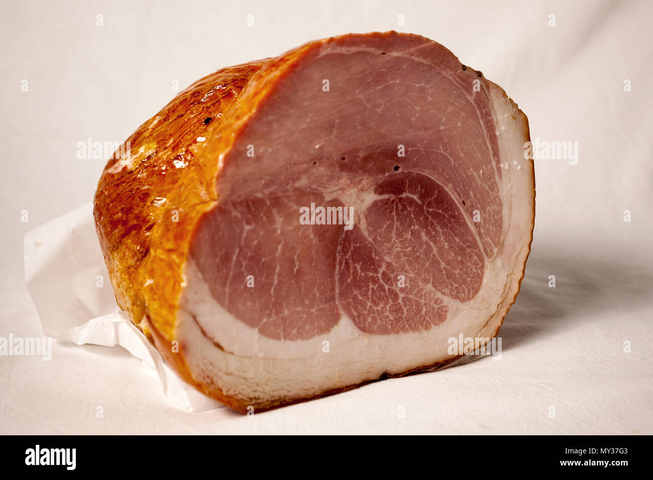 Typical italian cooked ham on a white background in the studio Stock ...