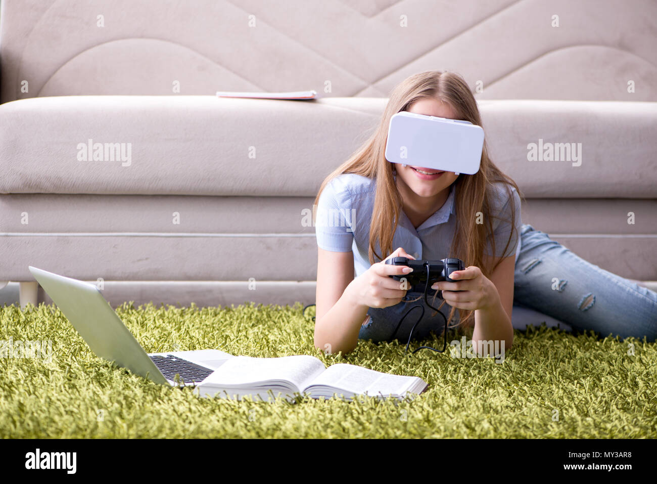 Young girl playing virtual reality games Stock Photo - Alamy