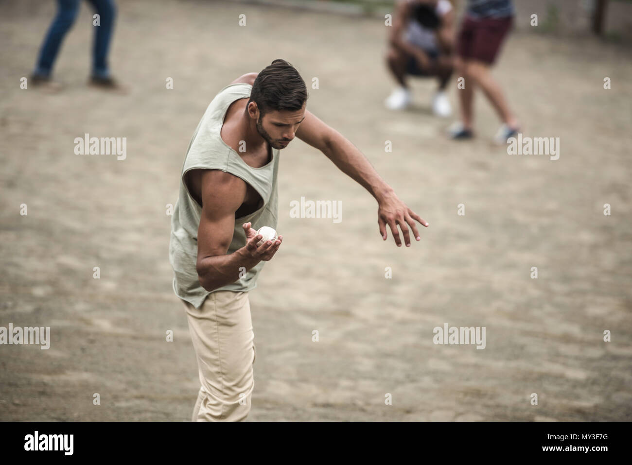 group of young multiethnic men playing baseball on court Stock Photo ...