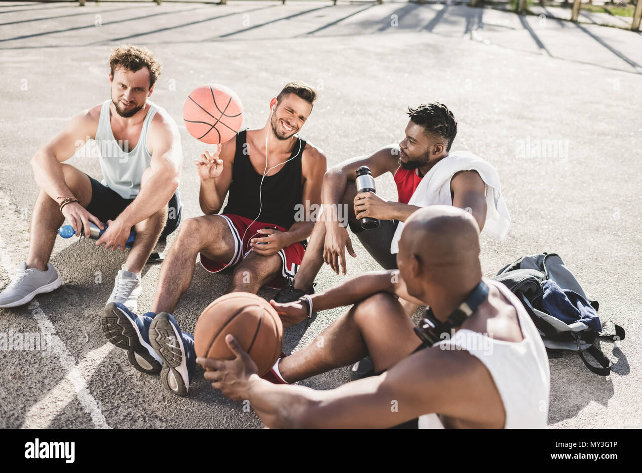 Men sitting on basketball court hi-res stock photography and images - Alamy