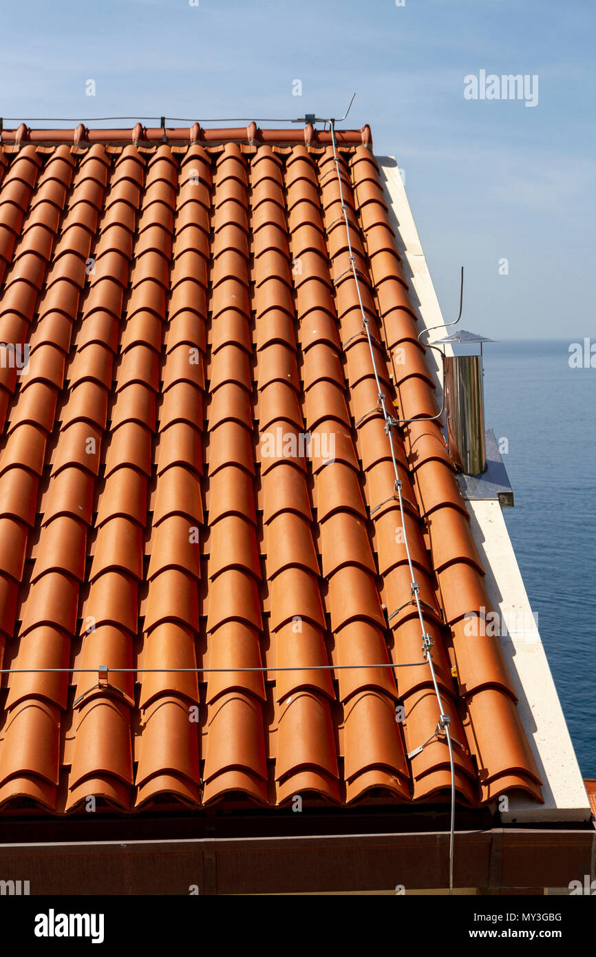 Modern tiled roof with metal lightning protection on a property in the ...