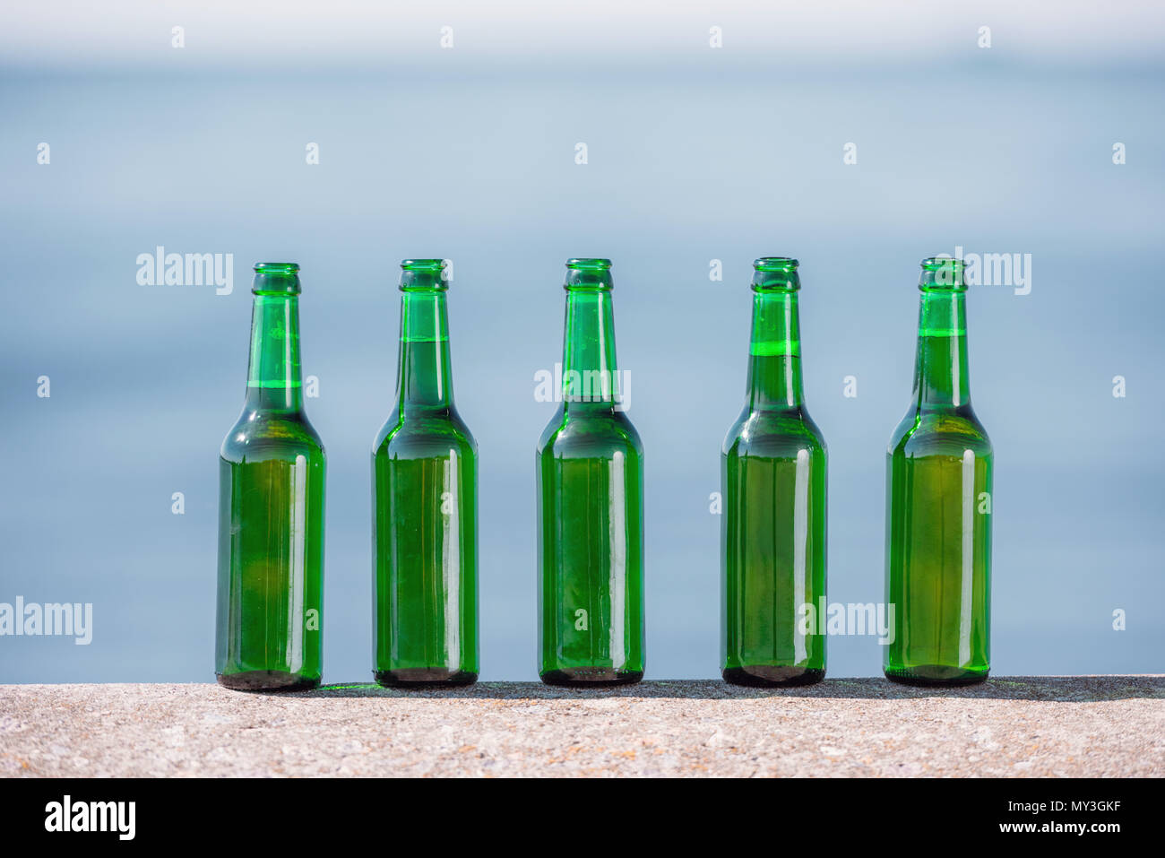 close up view of bottles of beer standing in line on parapet Stock ...