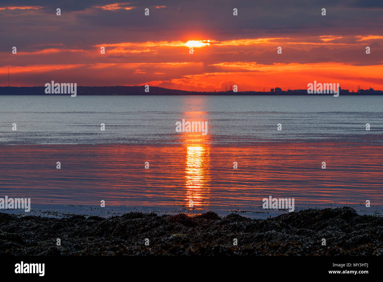 Sun setting over the Welsh hills Stock Photo - Alamy