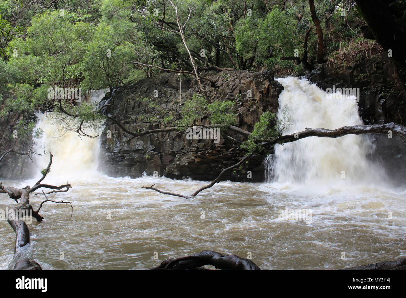 Two waterfalls, Twin Falls, cascading over rock into a turbulent stream ...