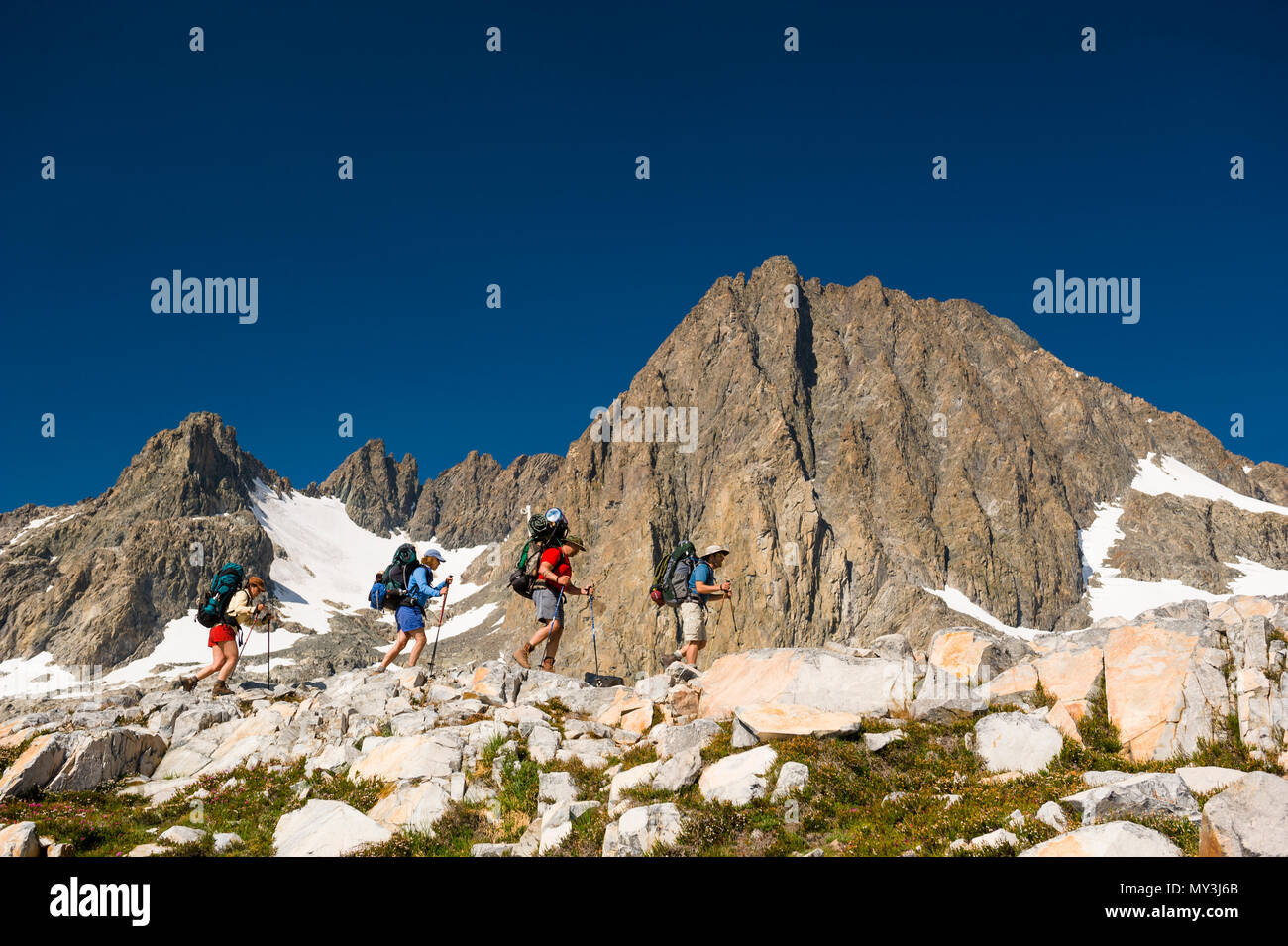 Hikers with mountain under Mt. Ritter near the Pacific Crest Trail in ...