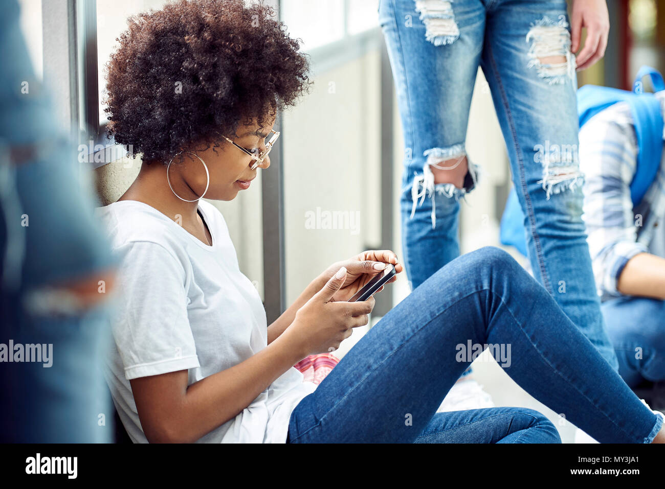 Female student using smartphone during break at school Stock Photo - Alamy