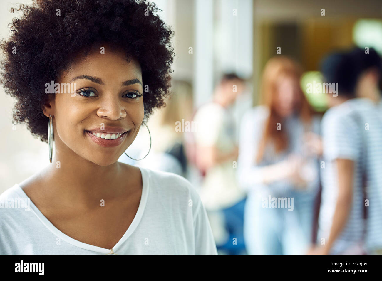 Female college student smiling cheerfully, portrait Stock Photo - Alamy