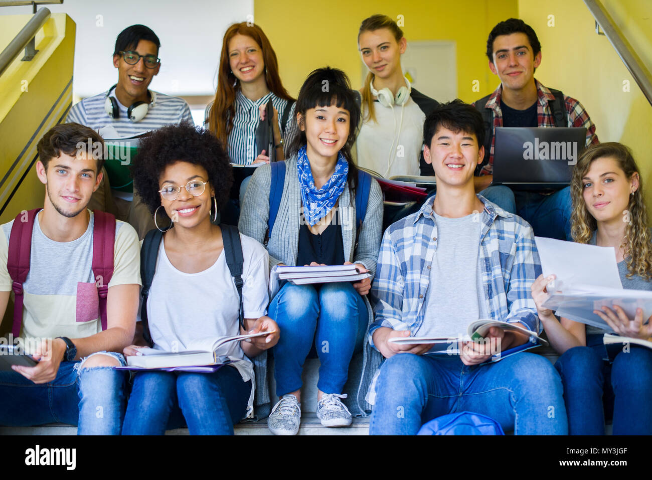Group of college students studying on stairs, portrait Stock Photo - Alamy
