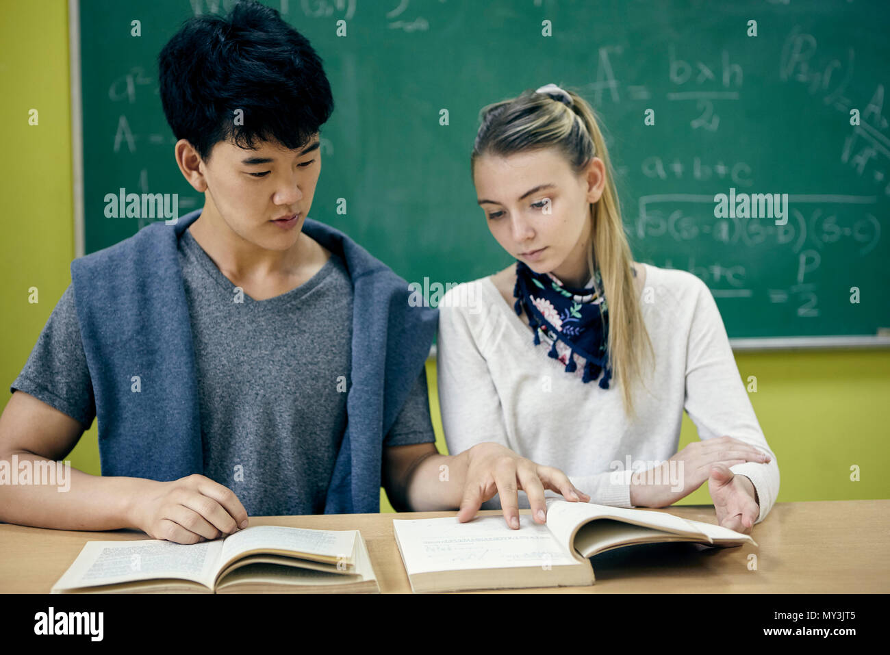 Students working together in math class Stock Photo - Alamy
