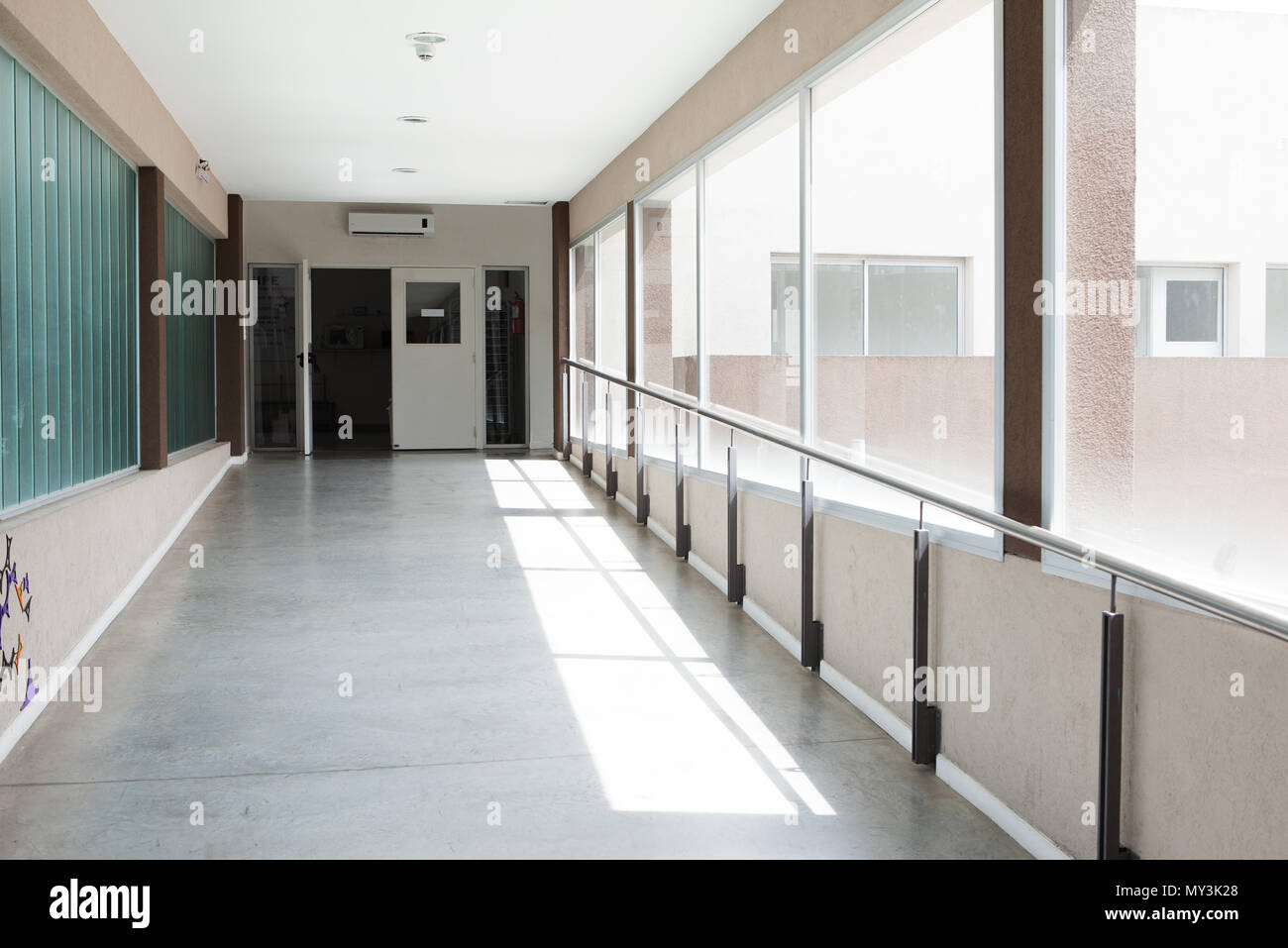 Sunlight shining through windows in empty corridor Stock Photo - Alamy