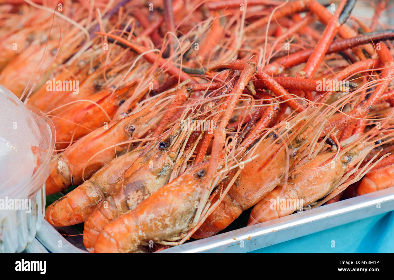 View of grilled prawn with salt flakes in aluminum tray Stock Photo - Alamy