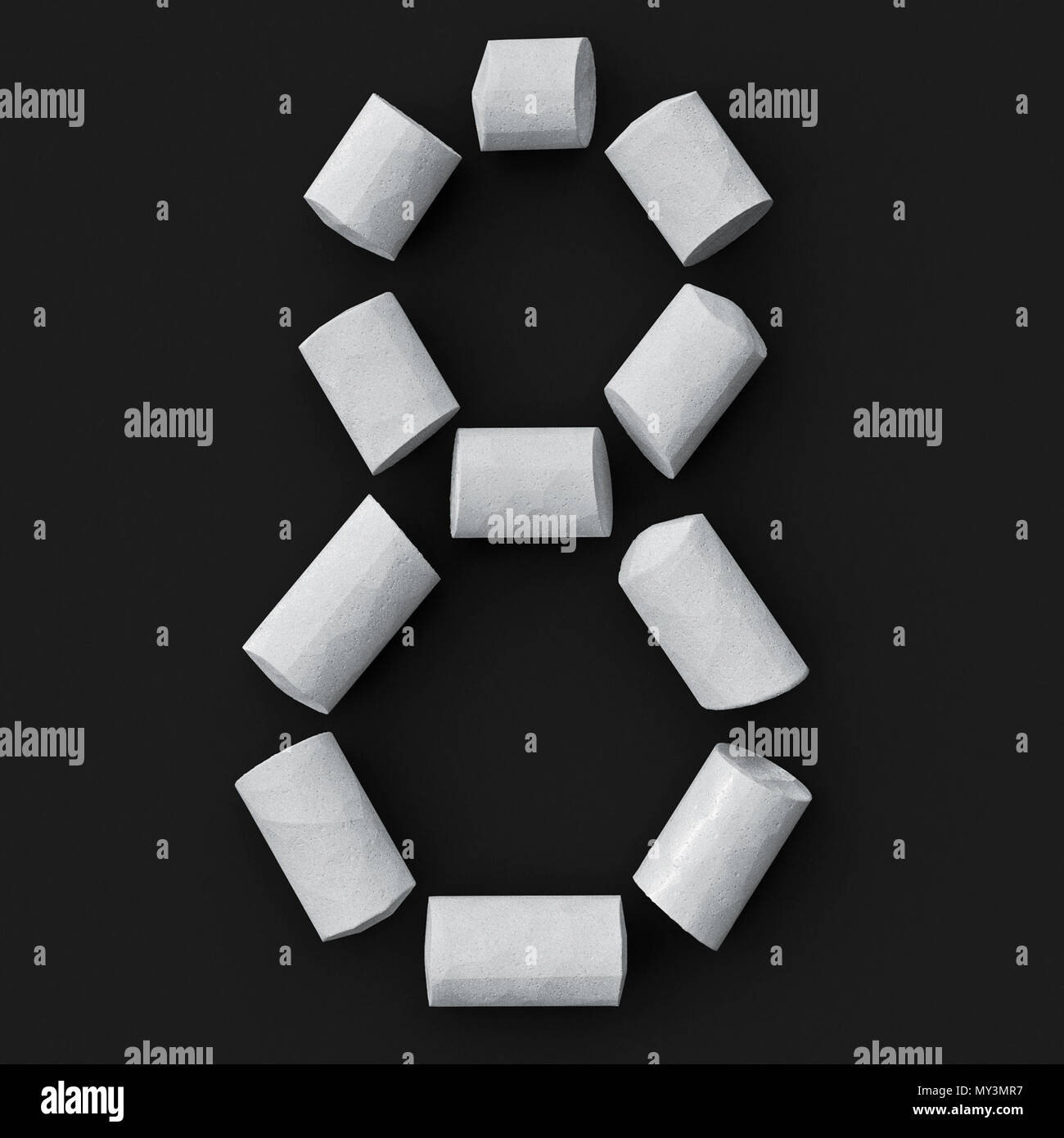 White blackboard chalks assembled like mathematical digit 8 on rough ...
