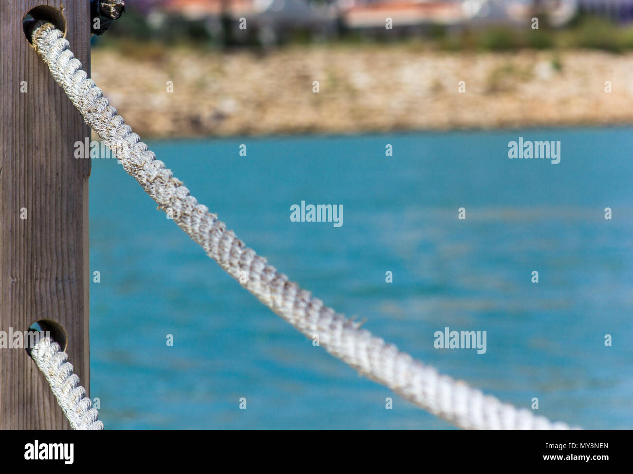Rope handrails made of rope against the blue sea Stock Photo - Alamy
