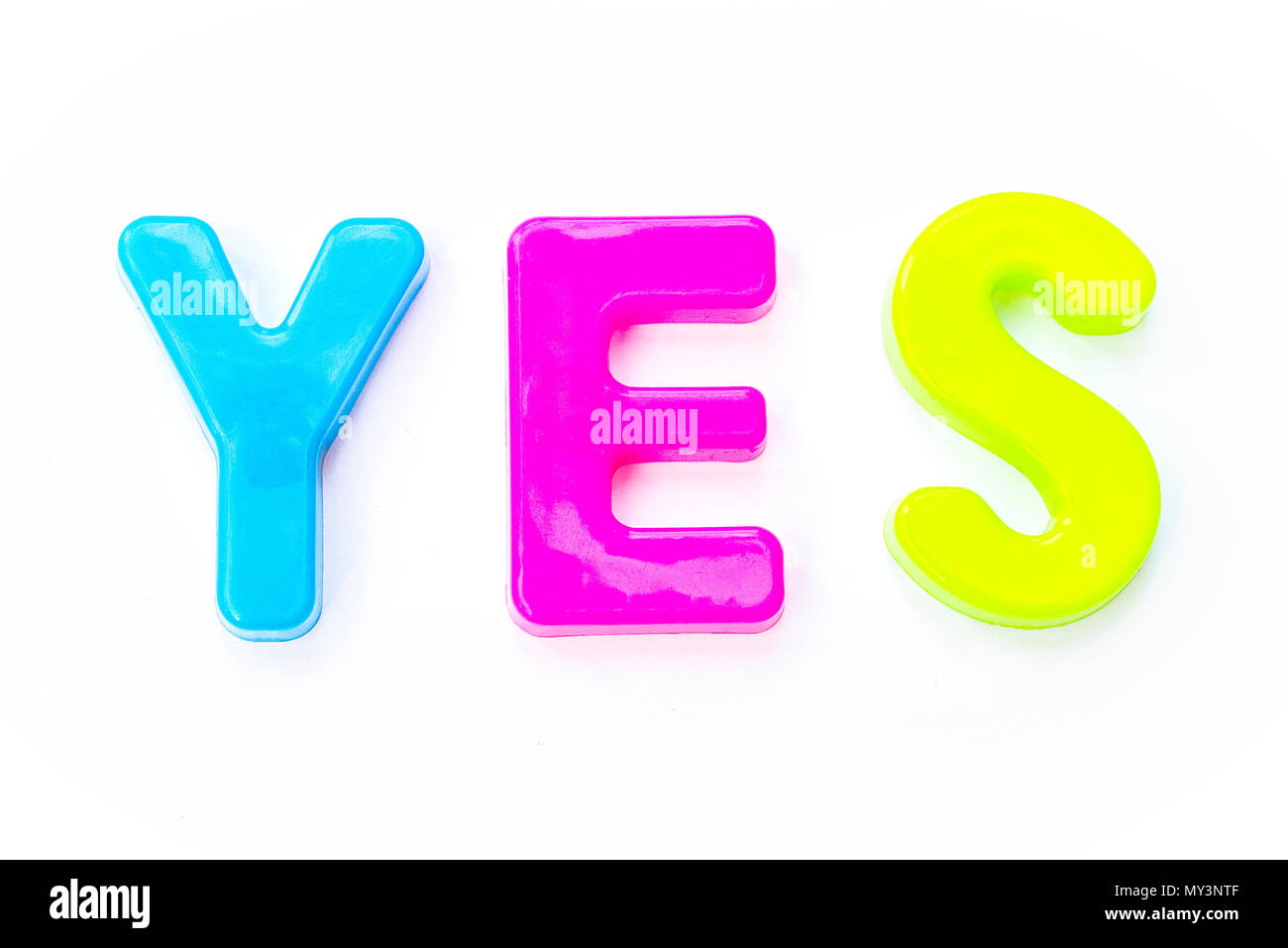 YES spelt out with coloured letters Stock Photo - Alamy