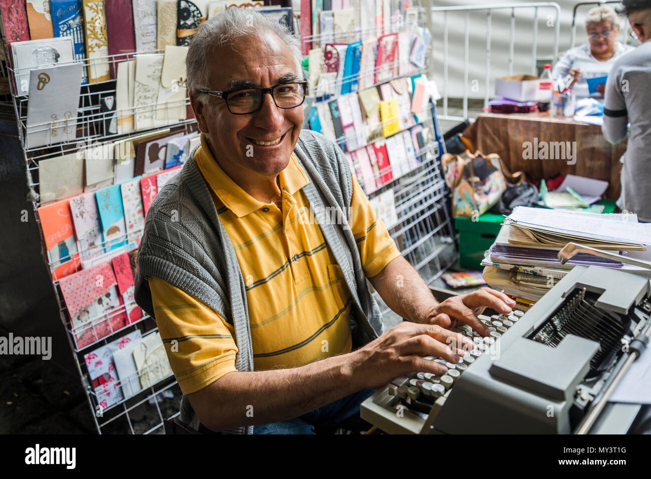 Clerk typing on electrical typewriter carrying on the ancient tradition ...