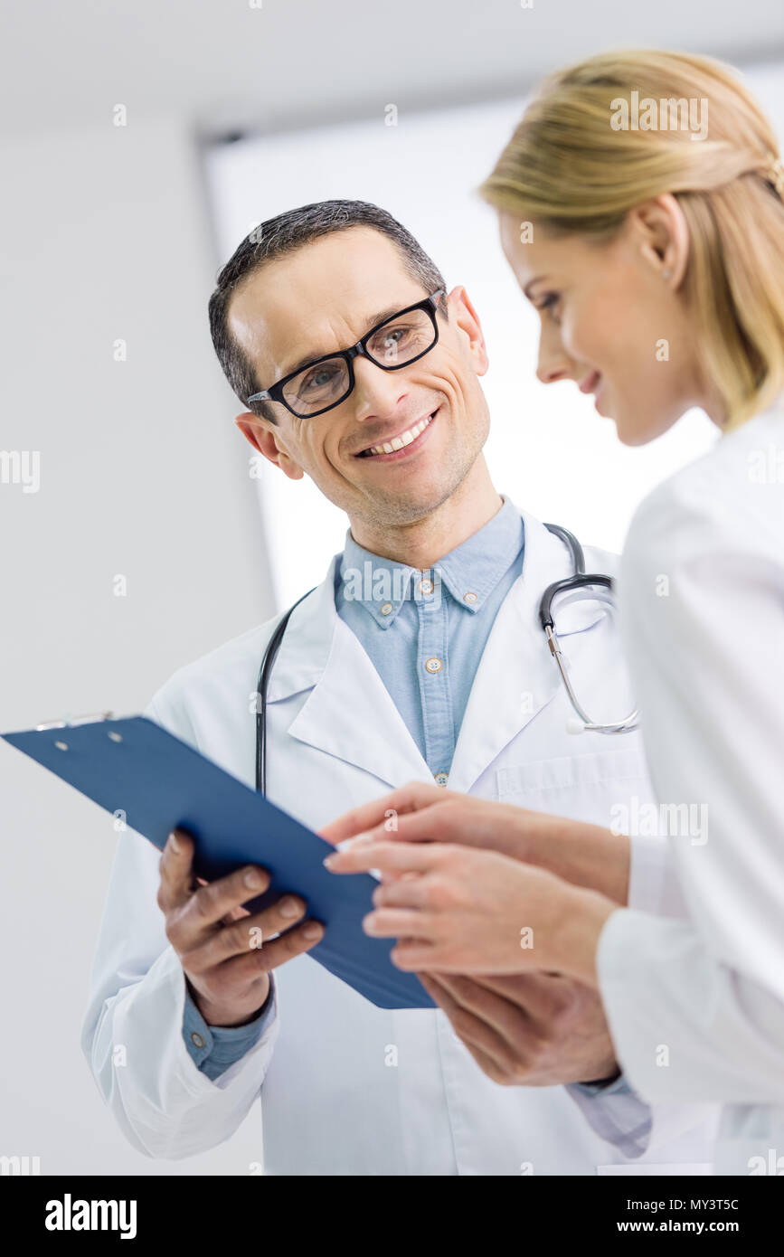 two doctors discussing diagnosis in hospital Stock Photo - Alamy